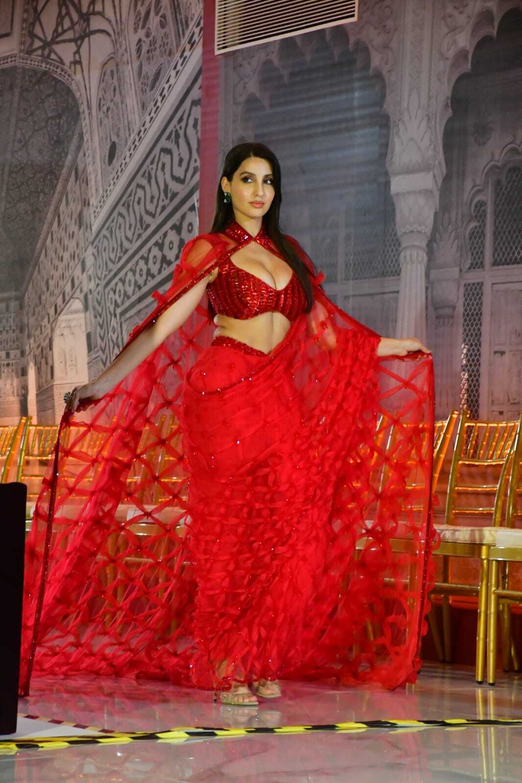 Nora Fatehi Mesmerizes in Fiery Red Saree at Jio World Plaza Launch ...