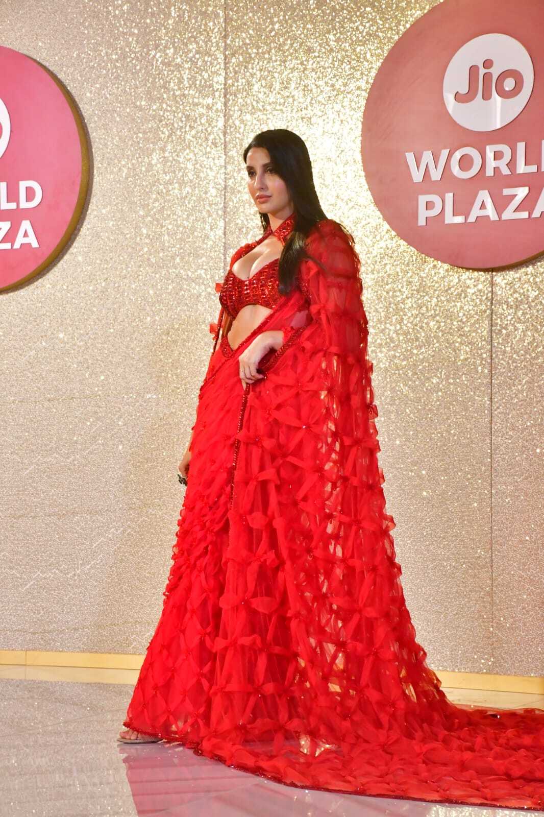 Nora Fatehi Mesmerizes in Fiery Red Saree at Jio World Plaza Launch ...